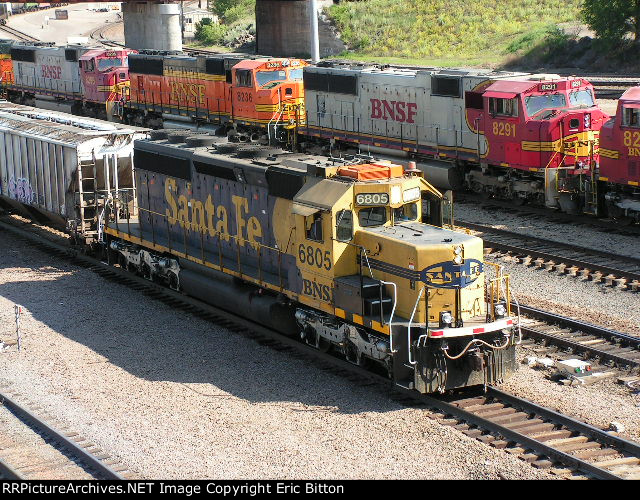 BNSF Switch Unit passing stored SD75M/Is